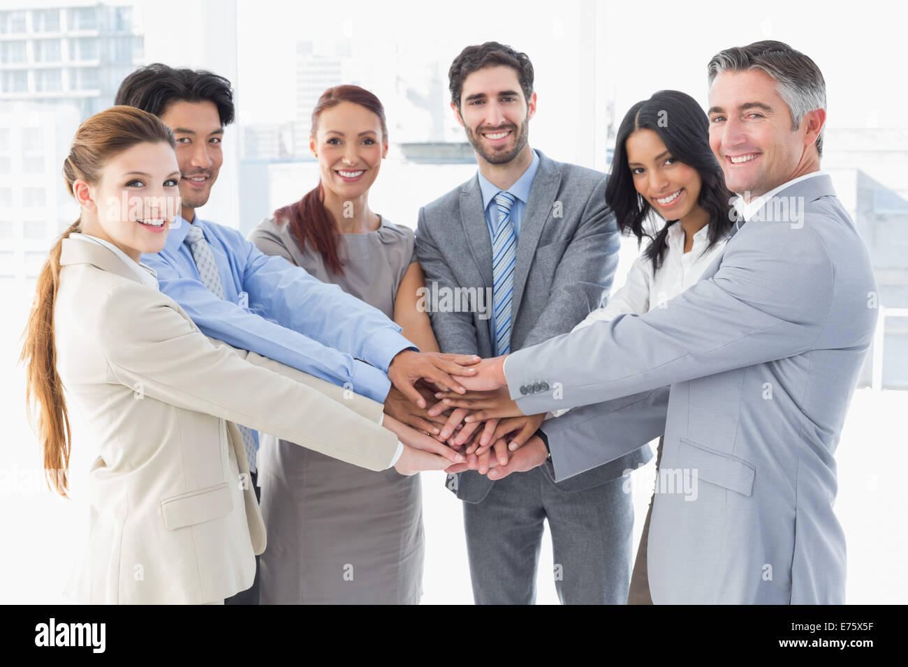 Business team stacking their hands Stock Photo - Alamy