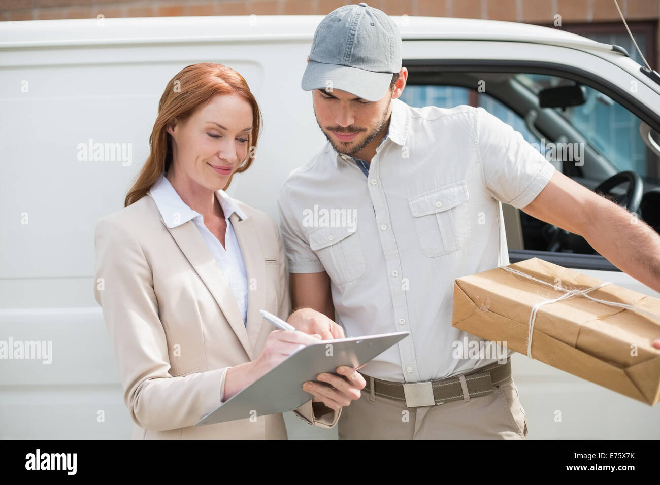 Female courier parcel showing hi-res stock photography and images - Alamy