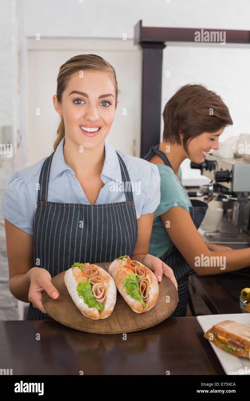 Pretty waitresses working with a smile Stock Photo - Alamy