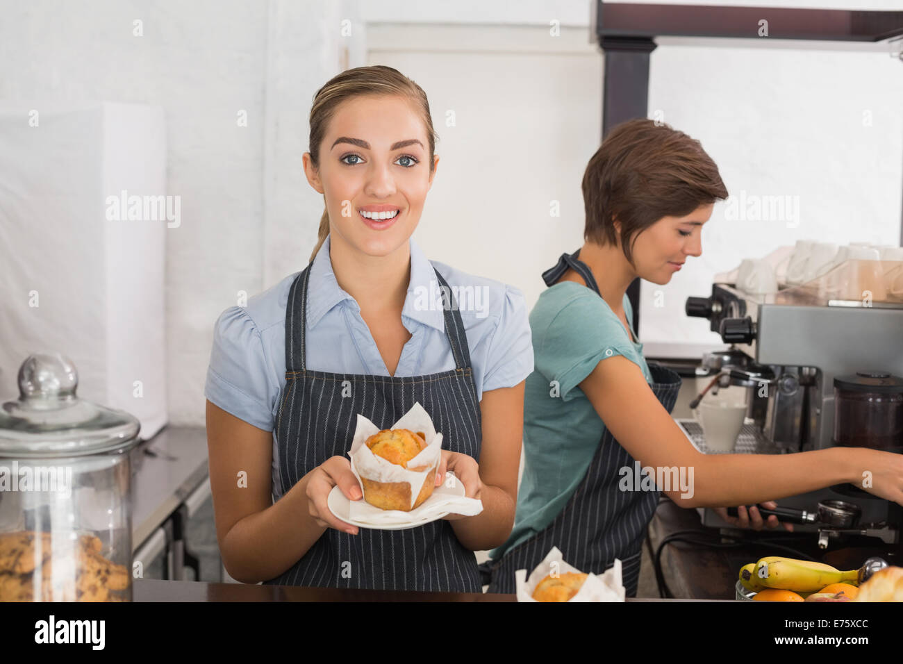 Pretty waitresses working with a smile Stock Photo - Alamy