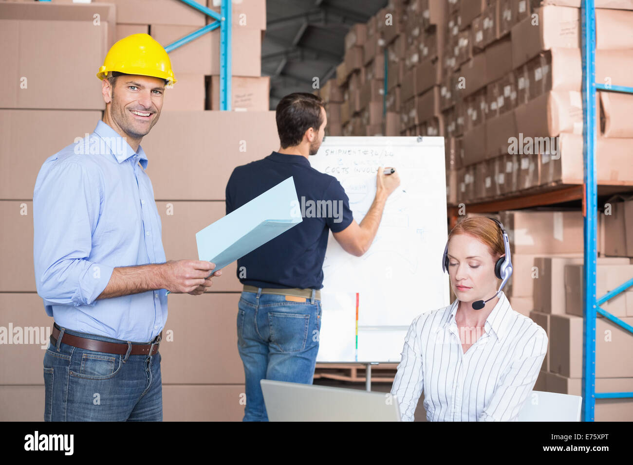 Warehouse team working together on shipment Stock Photo - Alamy