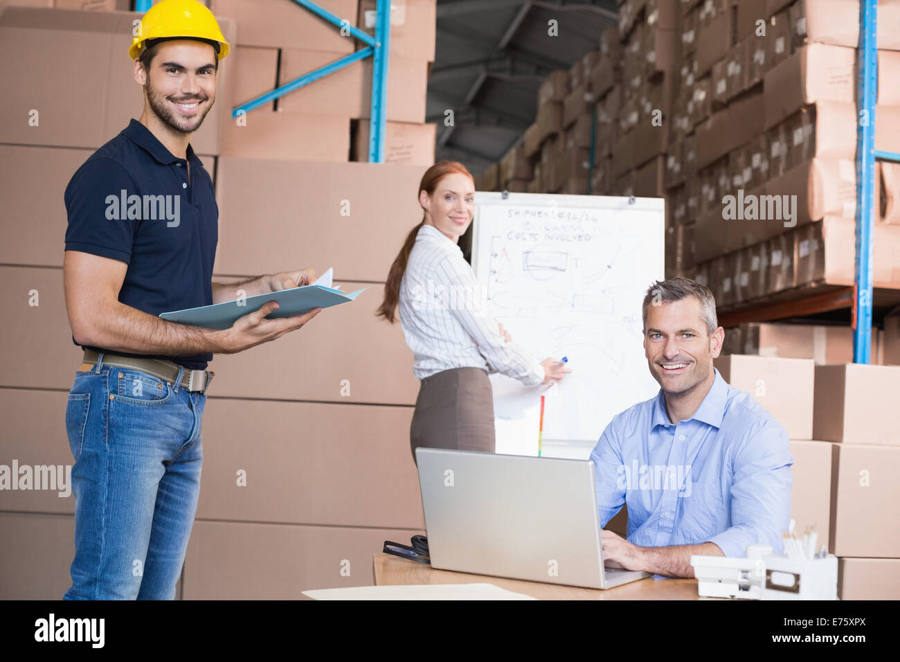 Warehouse team working together on shipment Stock Photo - Alamy
