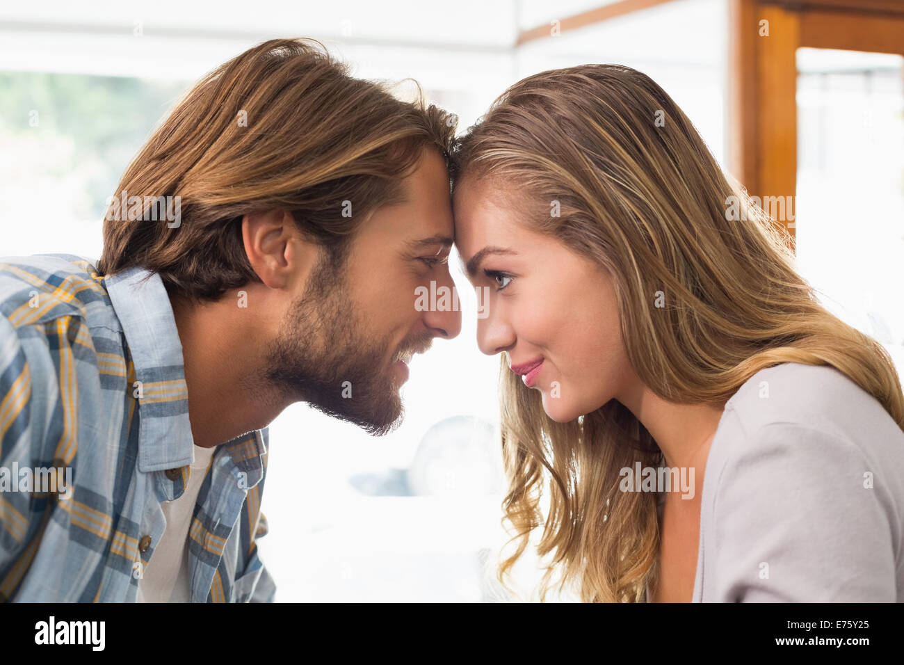Heads touching hi-res stock photography and images - Alamy