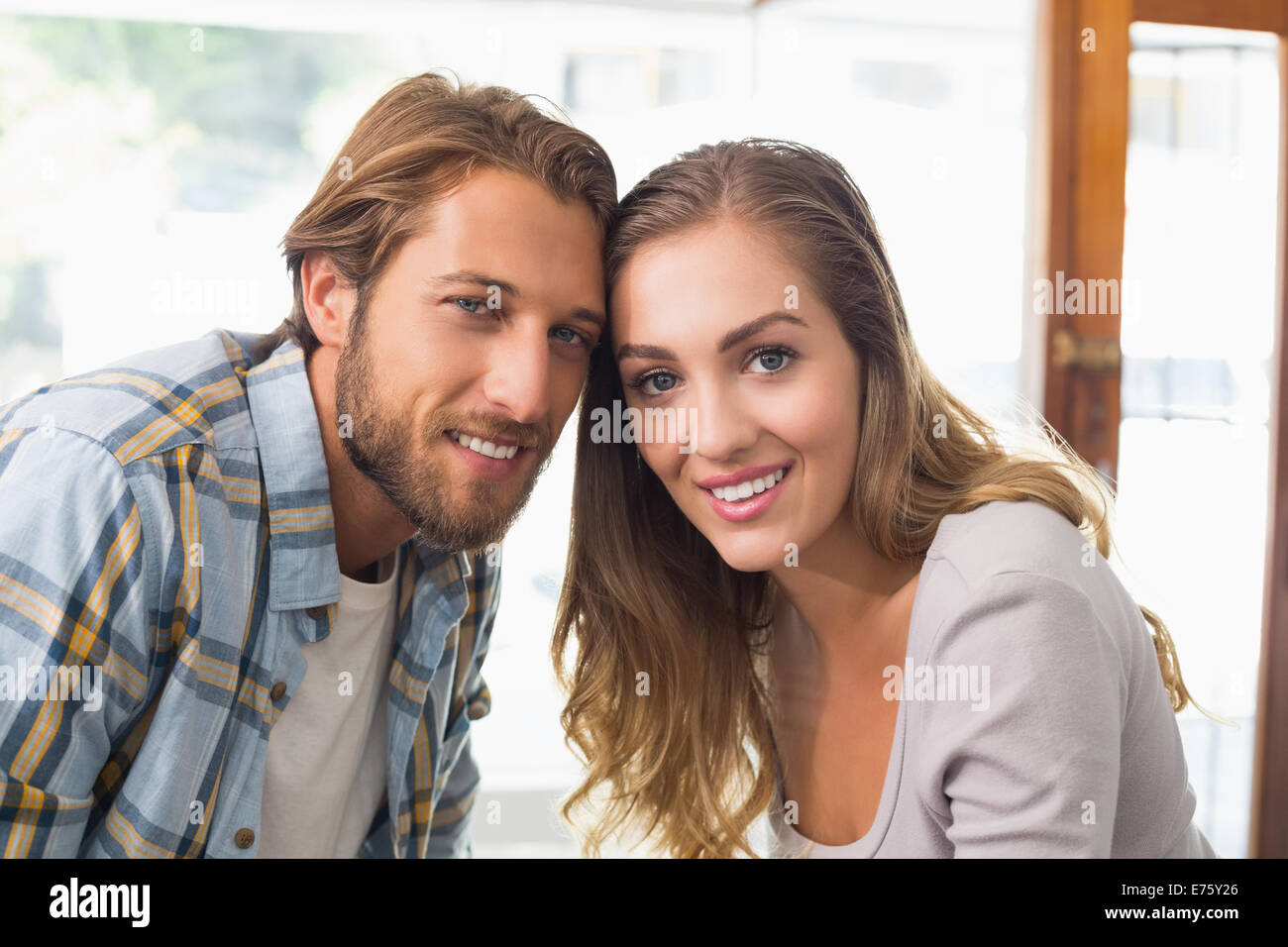 Looking at camera smiling sitting food and drink retail hi-res stock ...