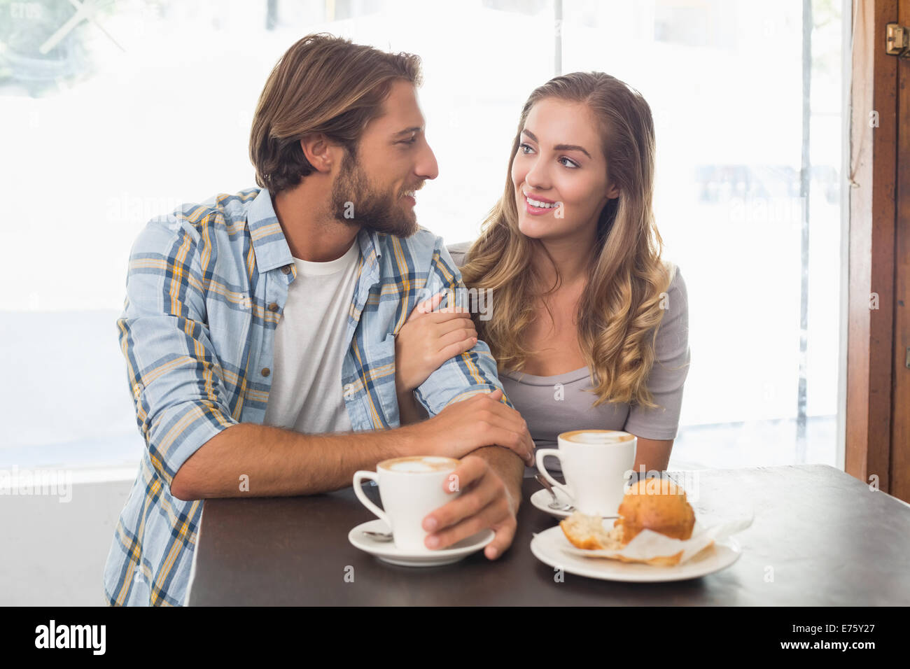 Happy couple enjoying a coffee Stock Photo - Alamy