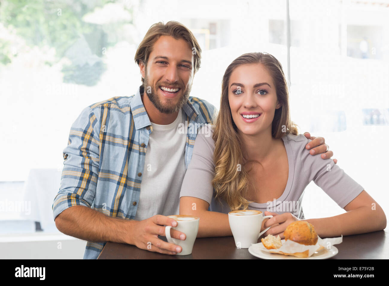Happy couple enjoying a coffee Stock Photo - Alamy