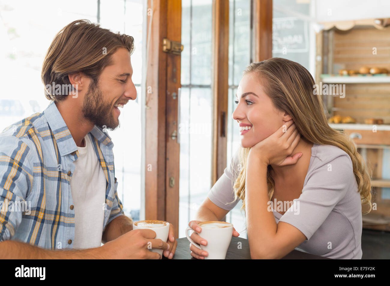 Happy couple enjoying a coffee Stock Photo - Alamy