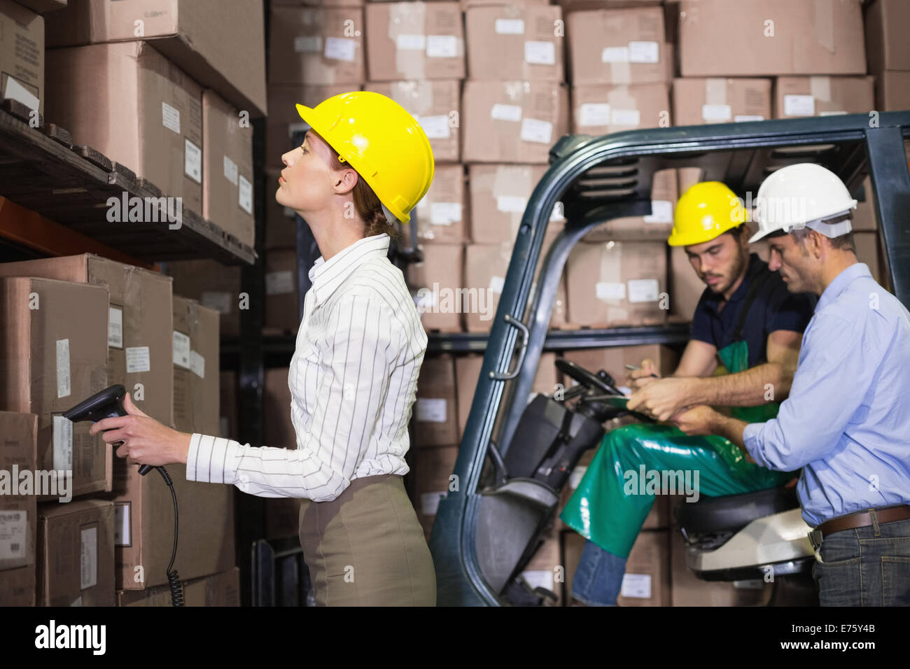 Warehouse team working during busy period Stock Photo - Alamy