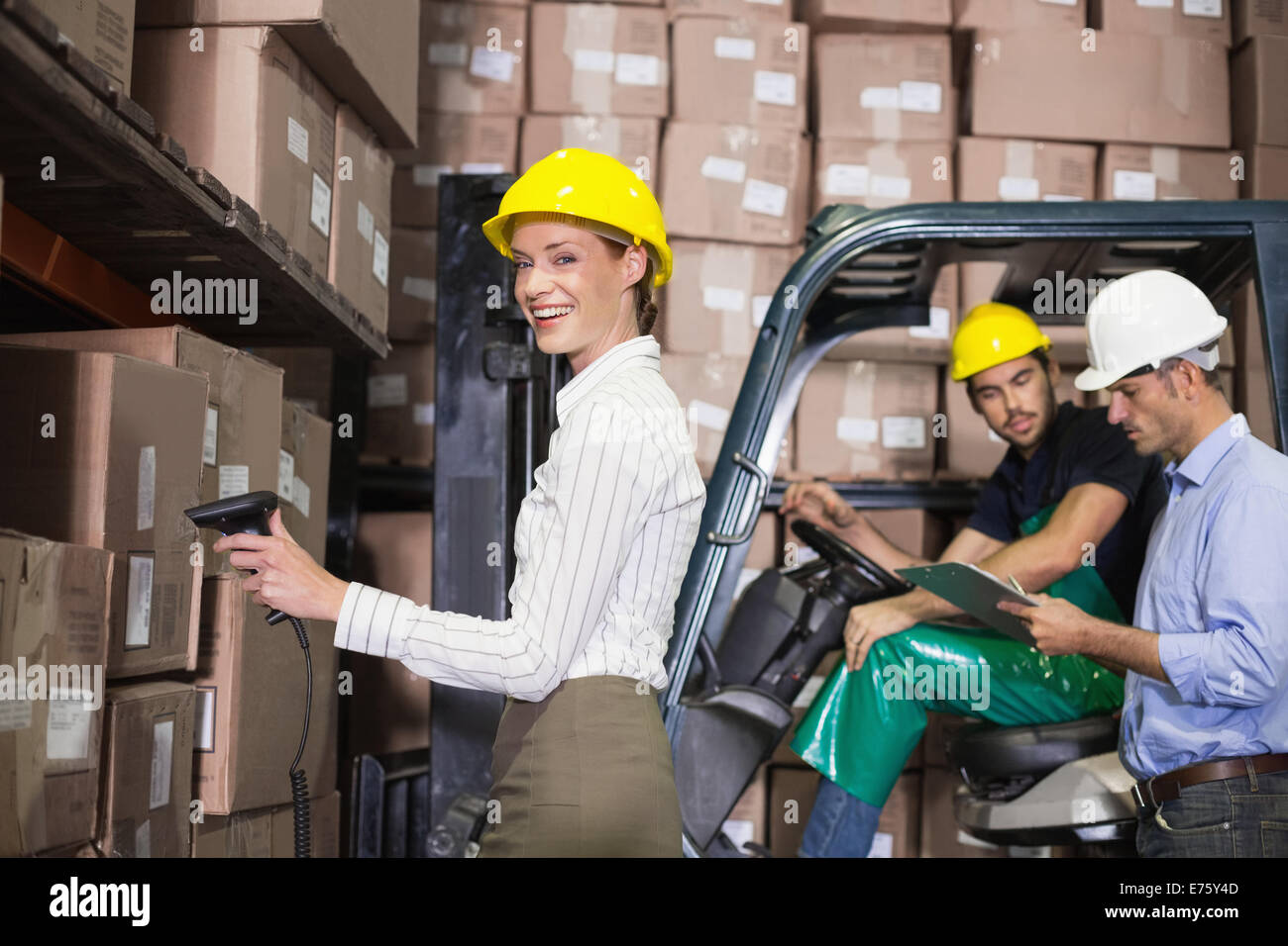 Warehouse team working during busy period Stock Photo - Alamy