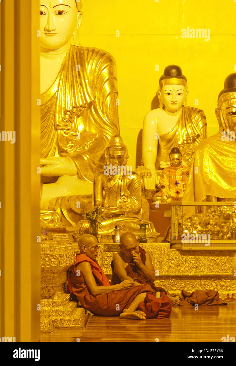 Two Buddhist monks with a mobile phone, Shwedagon Pagoda, Yangon ...
