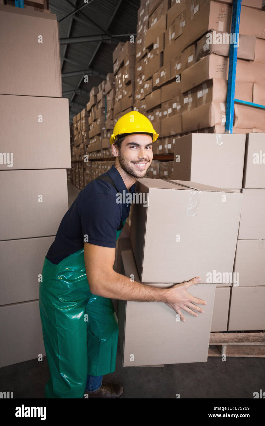 Warehouse worker loading up a pallet Stock Photo - Alamy