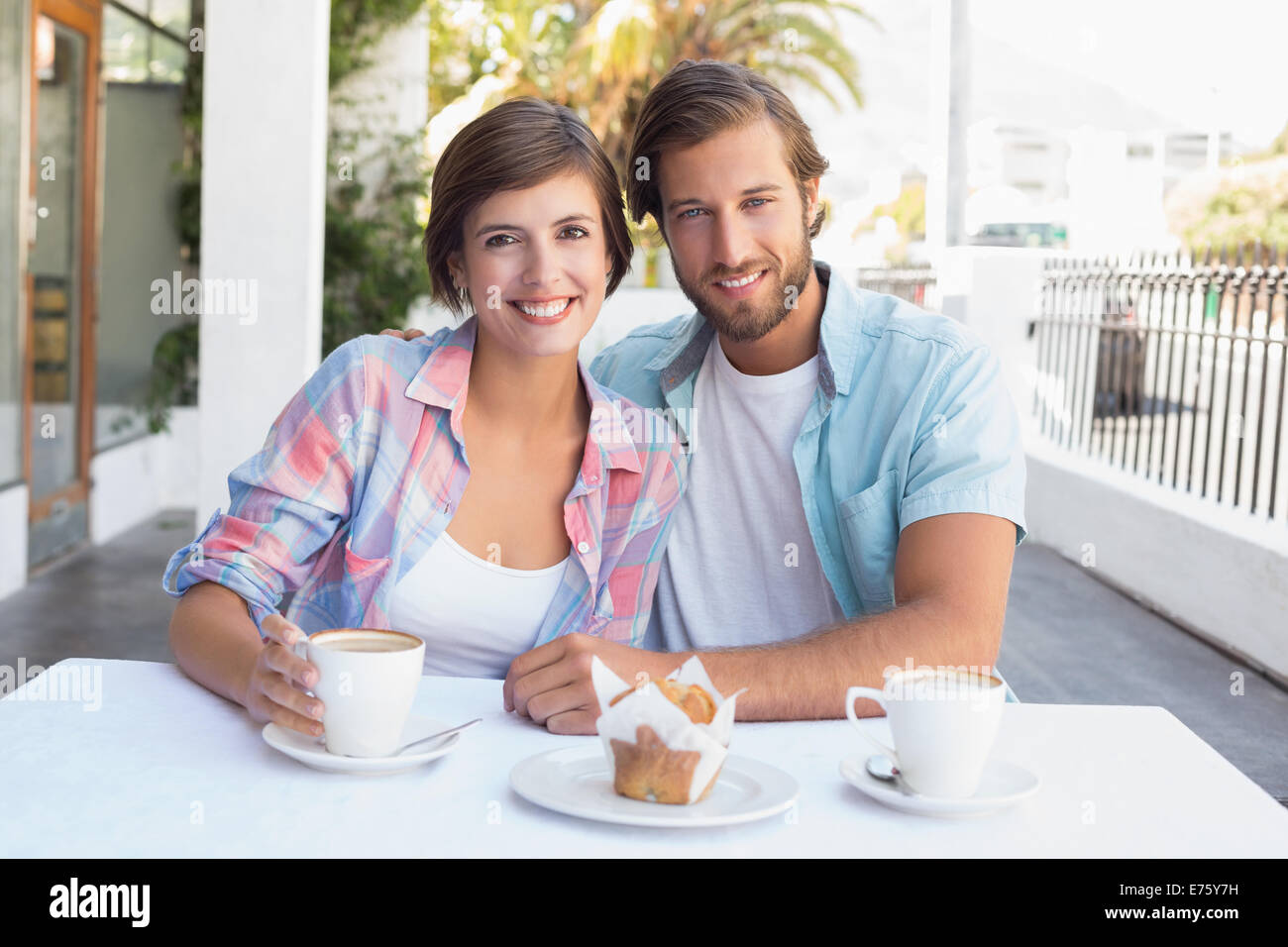 Happy couple enjoying coffee together Stock Photo - Alamy