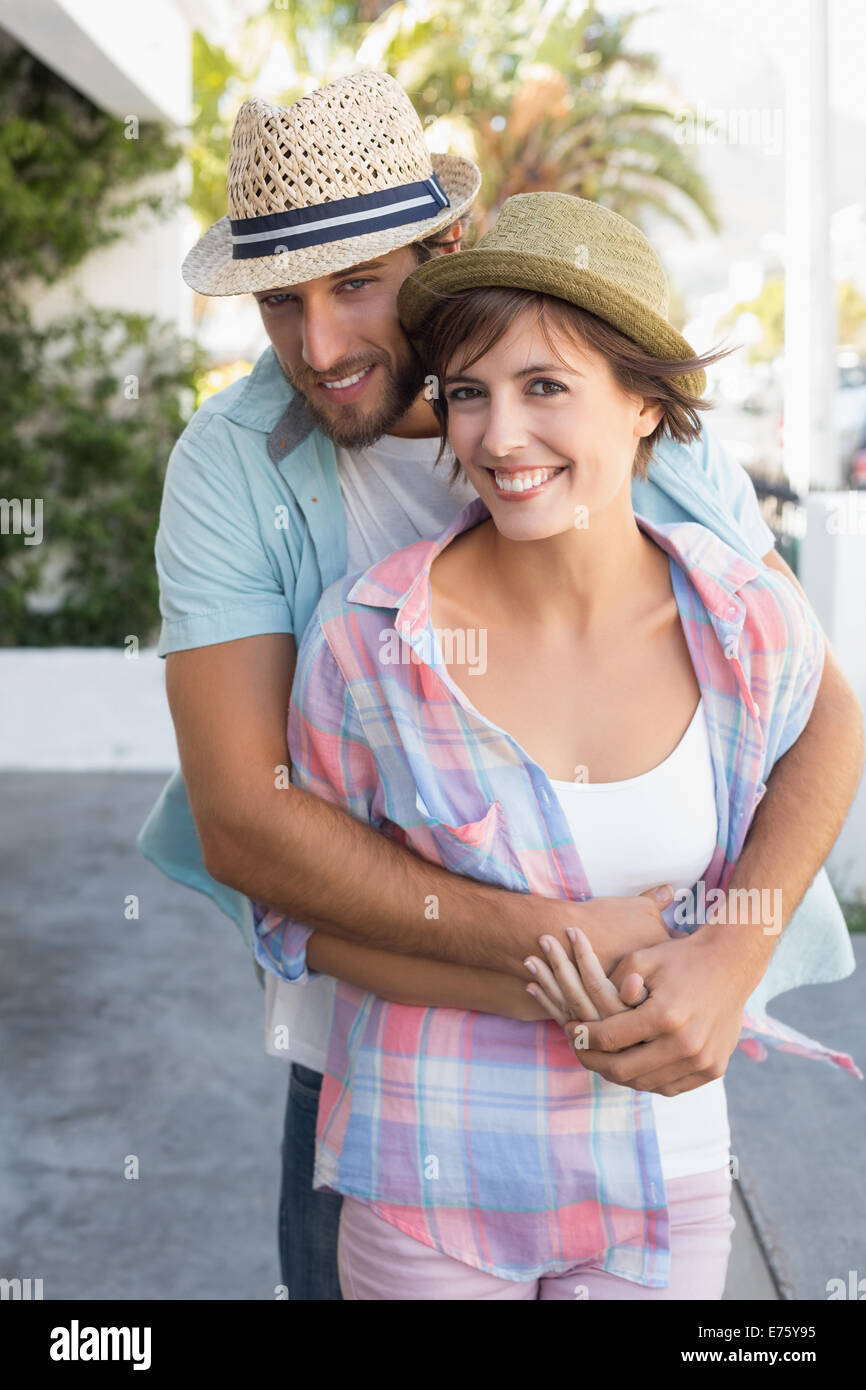 Happy couple smiling at camera Stock Photo - Alamy