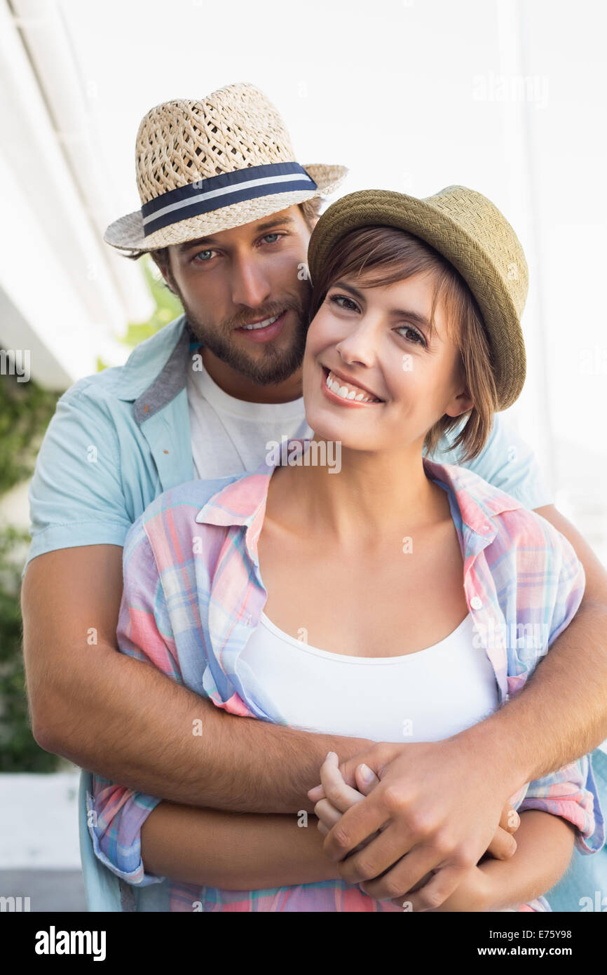 Happy couple standing and hugging Stock Photo - Alamy