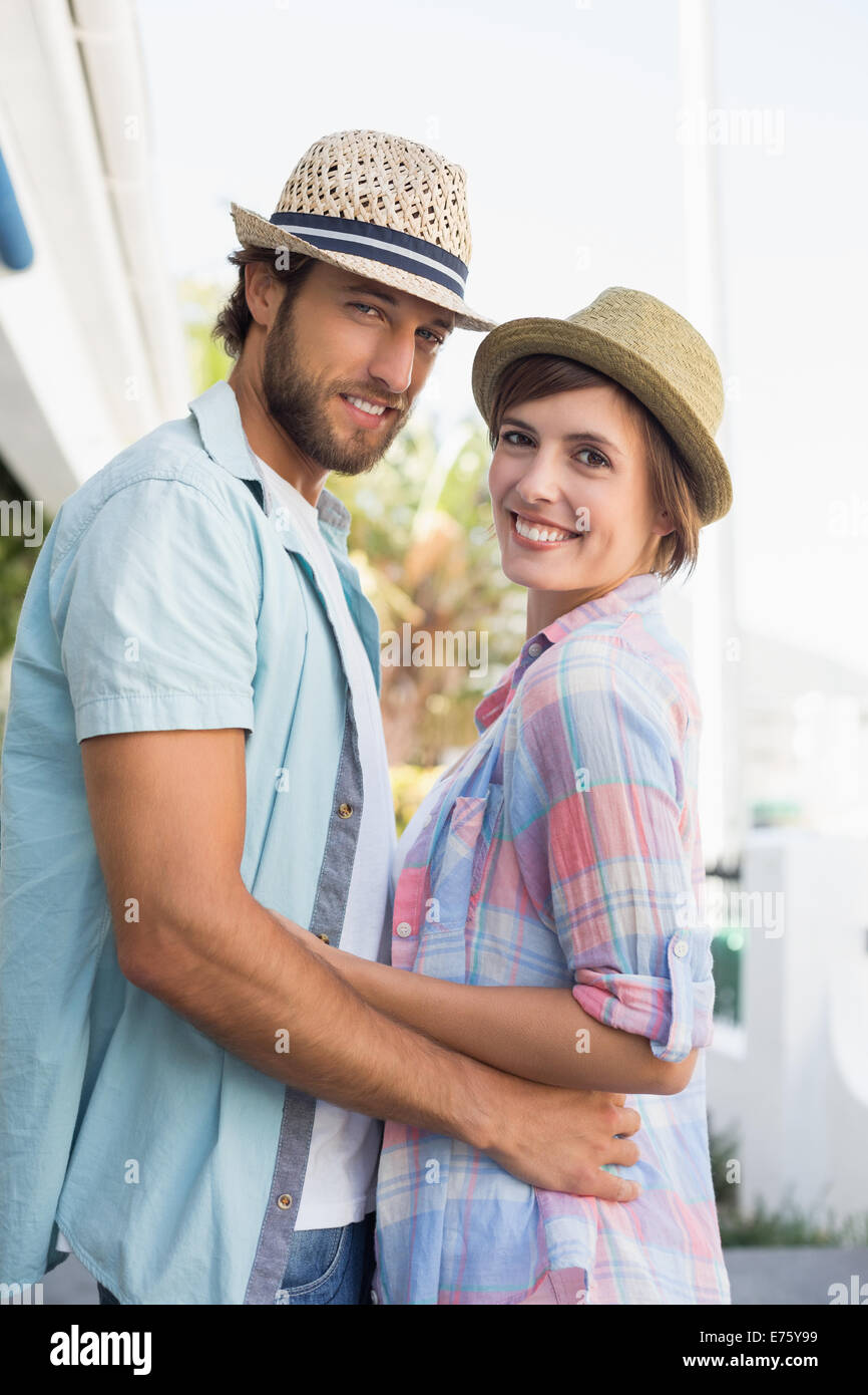 Happy couple standing and hugging Stock Photo - Alamy