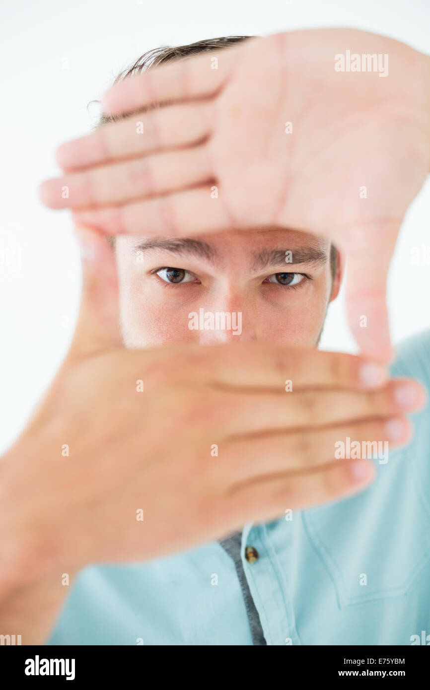 Young man making frame with his hands Stock Photo - Alamy