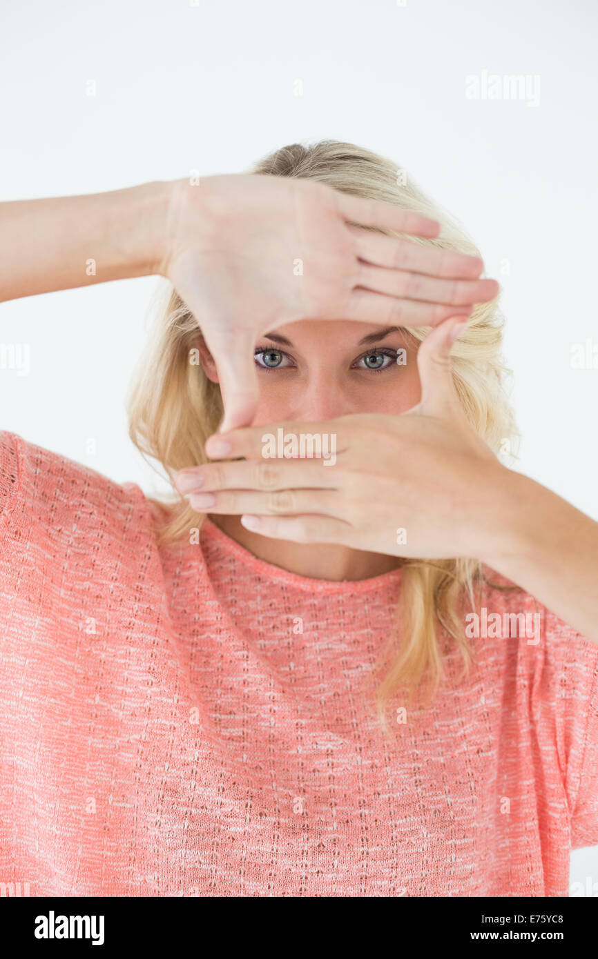 Young woman making frame with her hands Stock Photo - Alamy