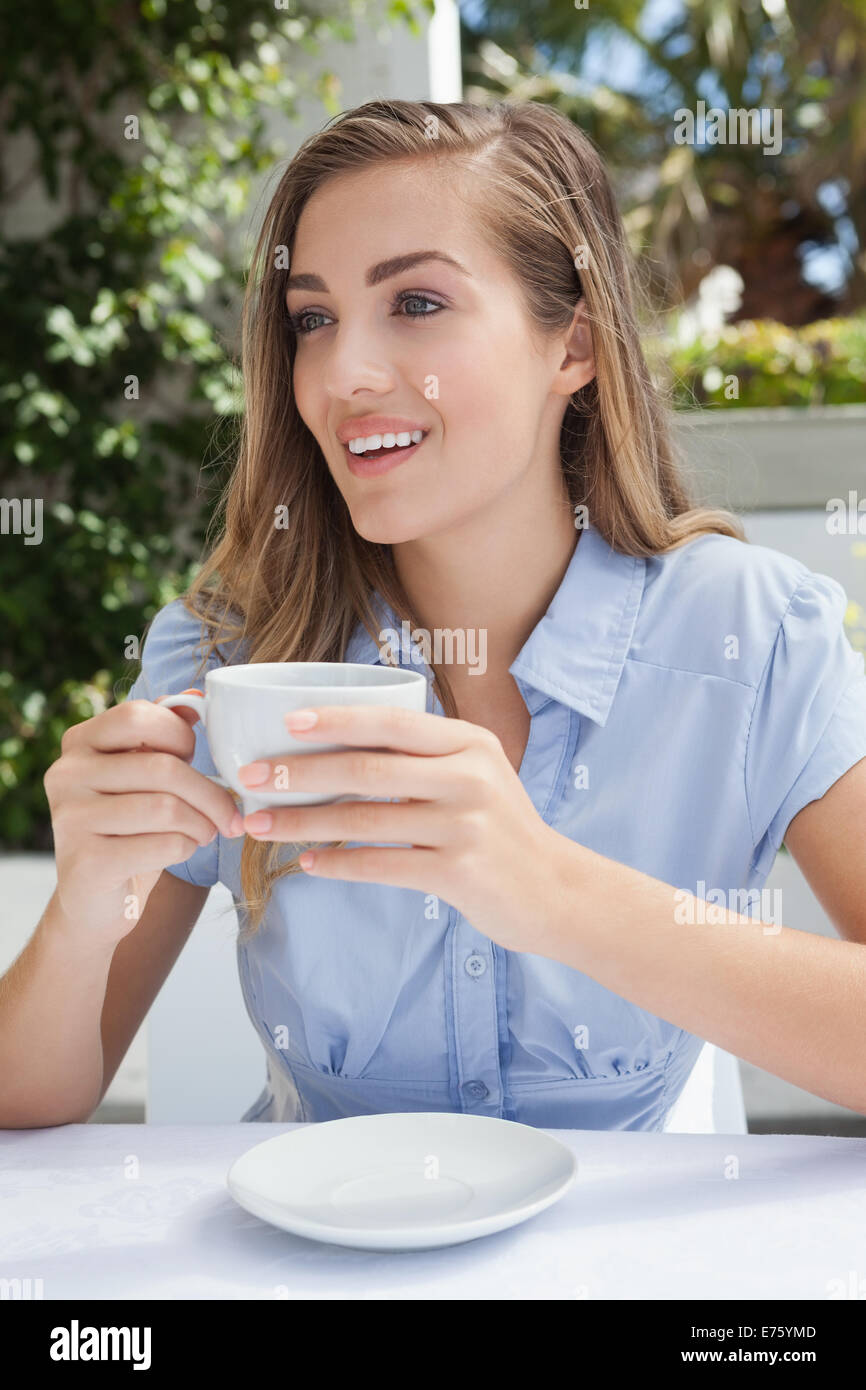 Beautiful woman having a coffee Stock Photo - Alamy