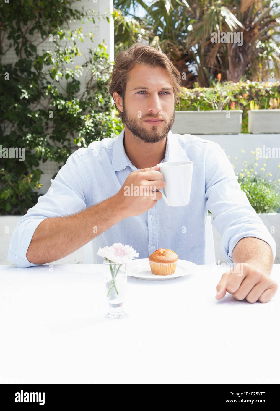 Thoughtful man having a coffee Stock Photo - Alamy