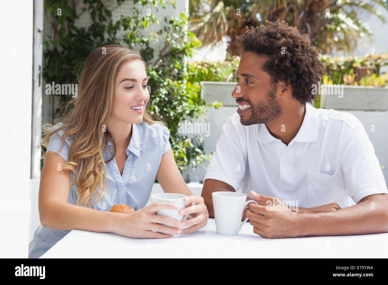 Happy couple having coffee together Stock Photo - Alamy