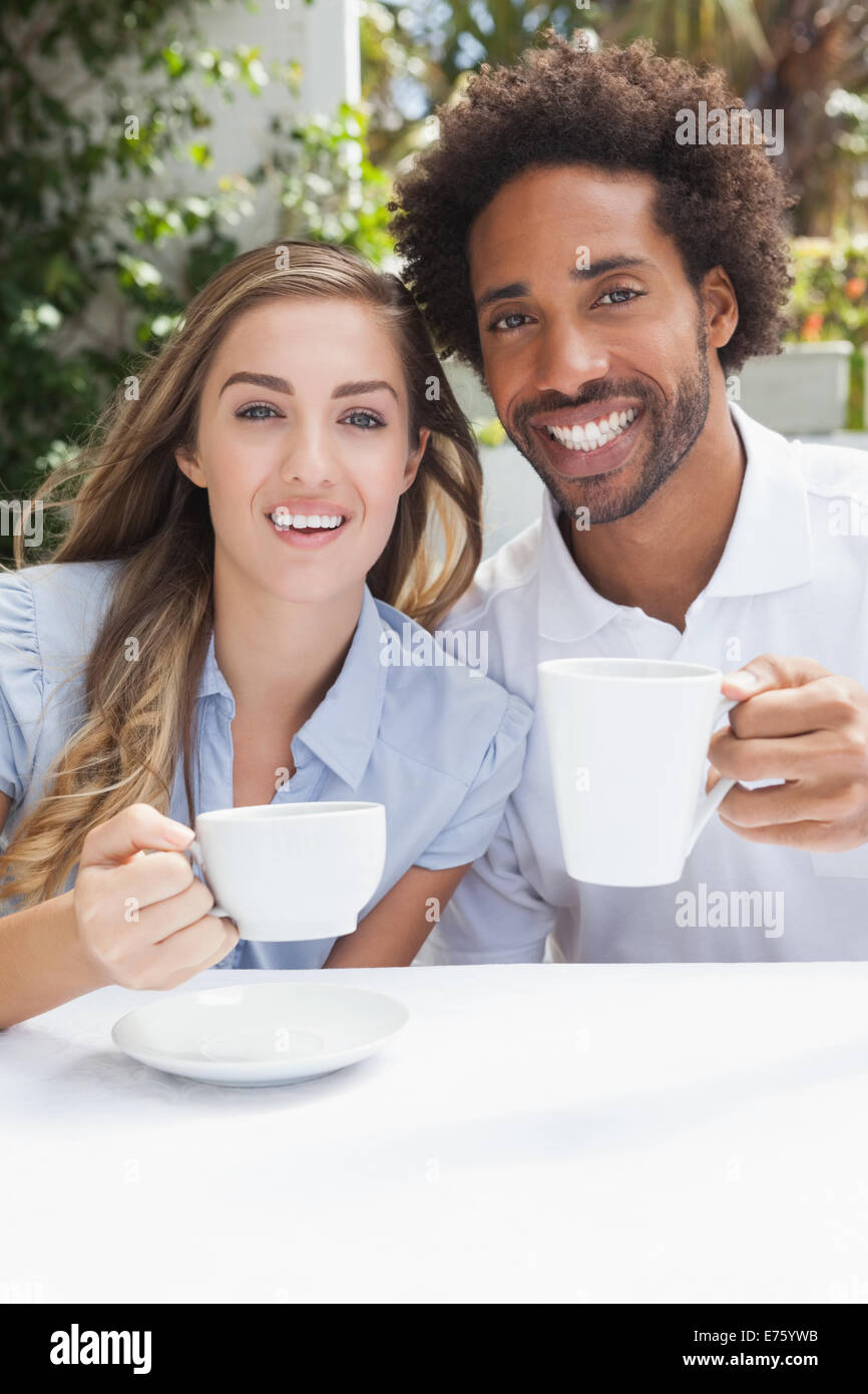 Happy couple having coffee together Stock Photo - Alamy