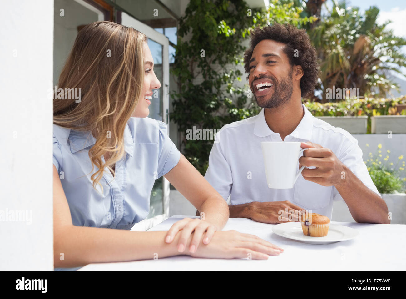 Happy couple having coffee together Stock Photo - Alamy