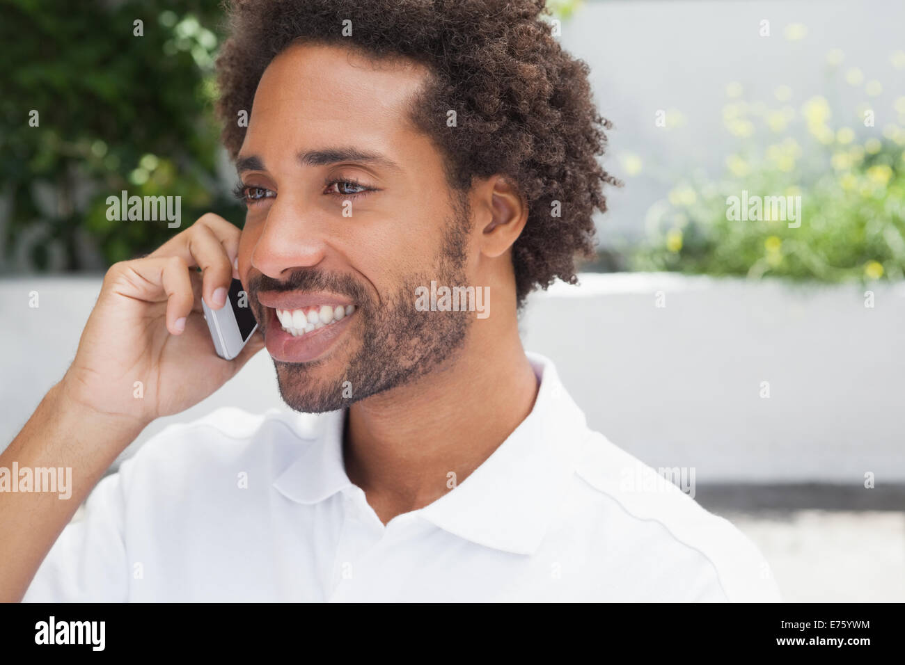 Smiling man on the phone Stock Photo - Alamy