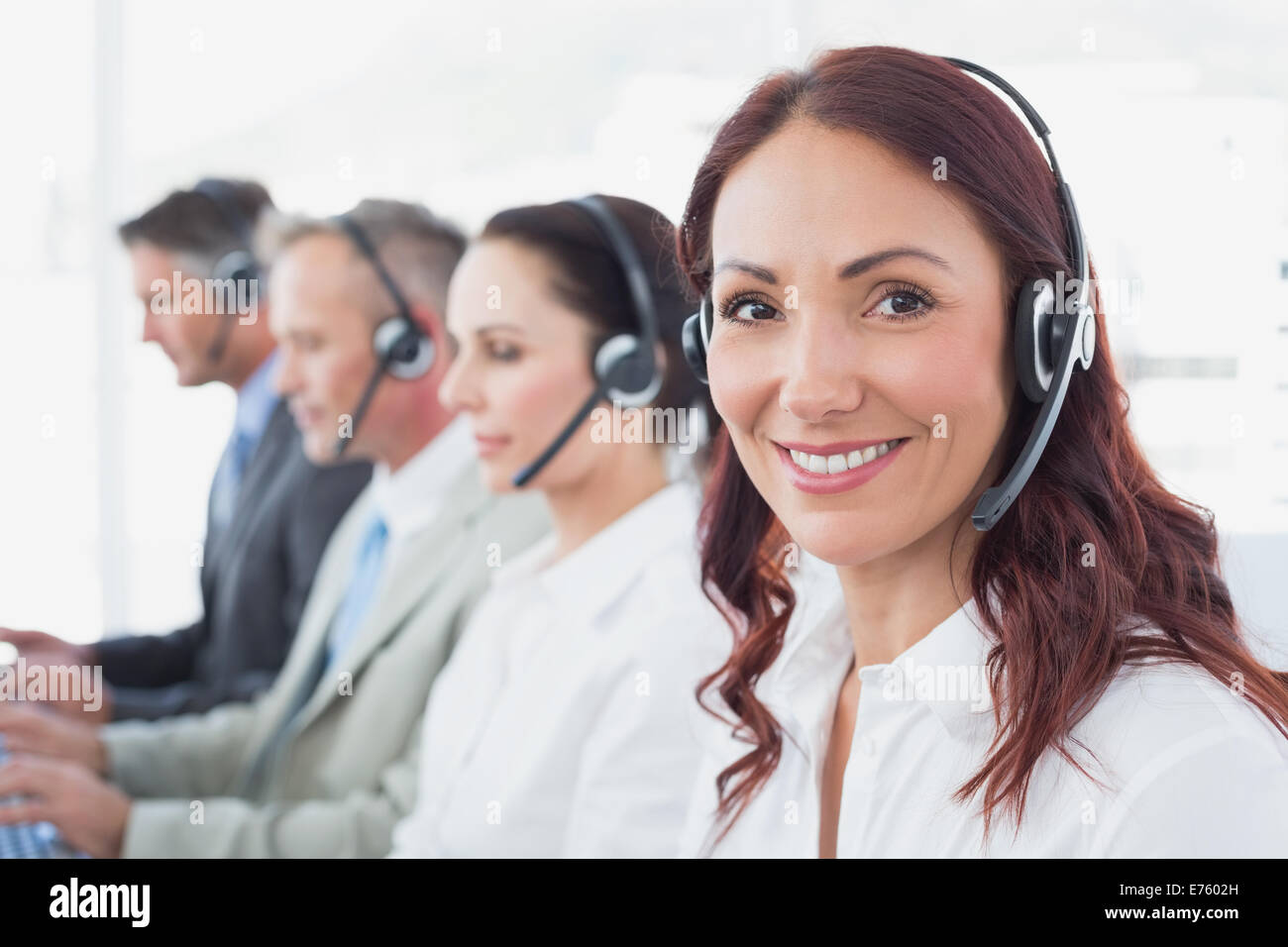 Call center workers wearing headsets Stock Photo - Alamy