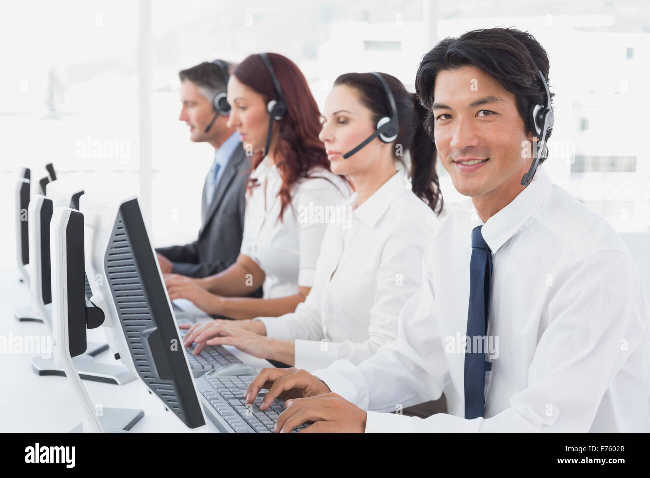 Employee's typing on their computers Stock Photo - Alamy