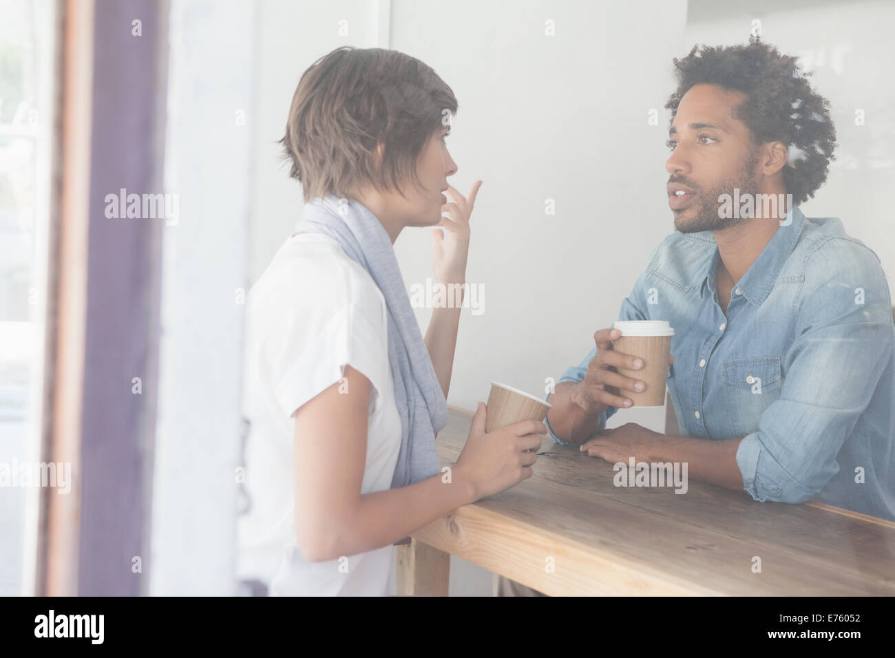 Casual couple having coffee together Stock Photo - Alamy