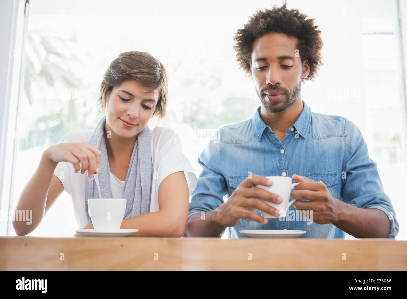 Casual couple having coffee together Stock Photo - Alamy