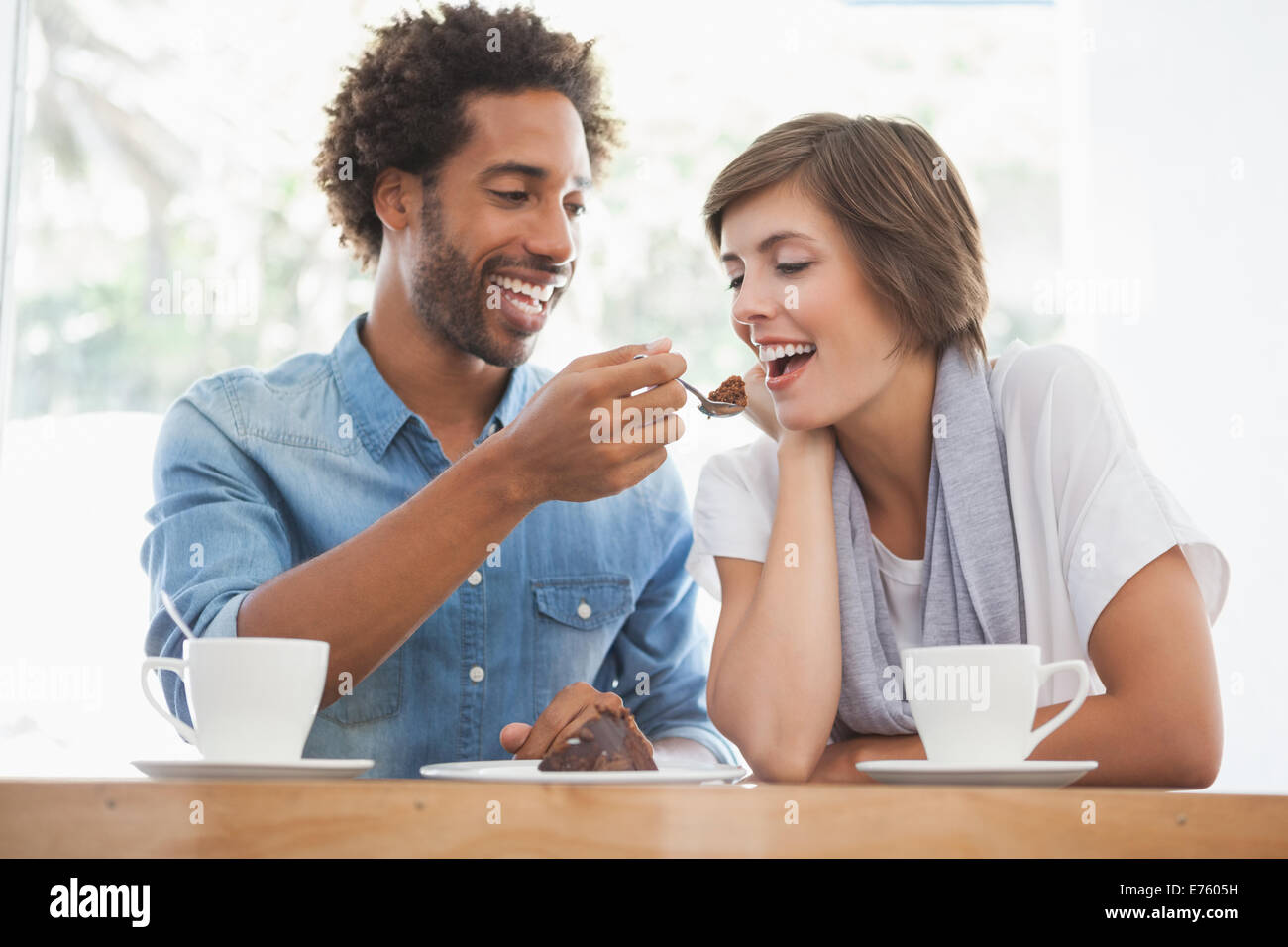 Casual couple having coffee together Stock Photo - Alamy