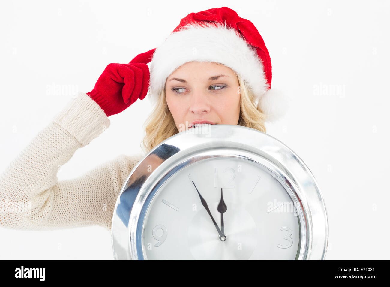 Attractive santa woman holding cropped clock Stock Photo - Alamy