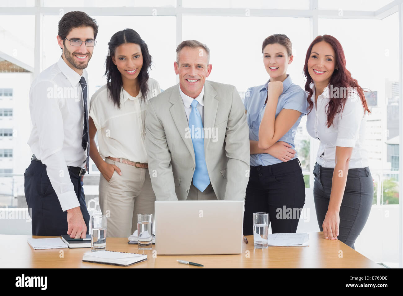 Business people smiling at camera Stock Photo - Alamy