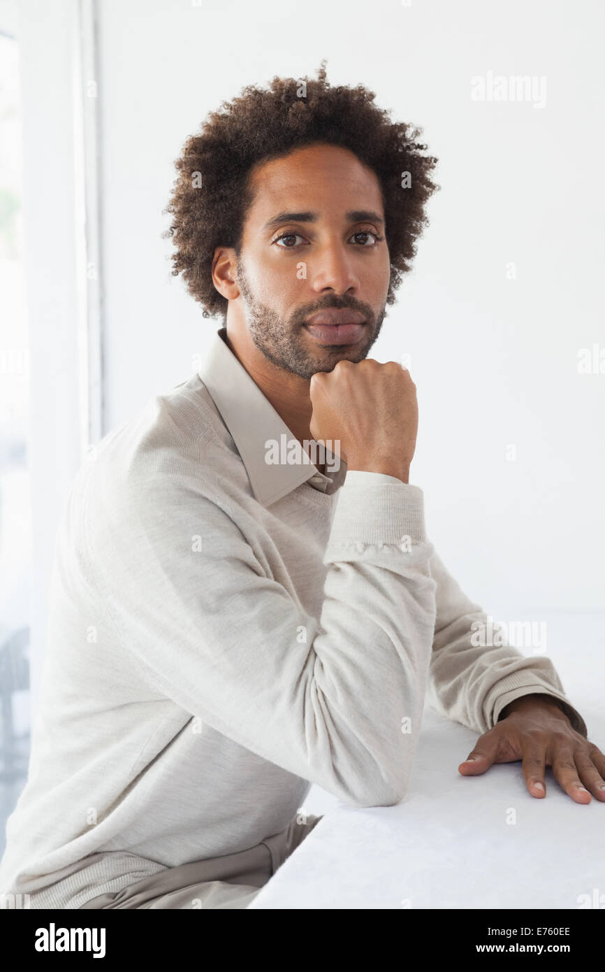 Handsome man looking at camera Stock Photo - Alamy
