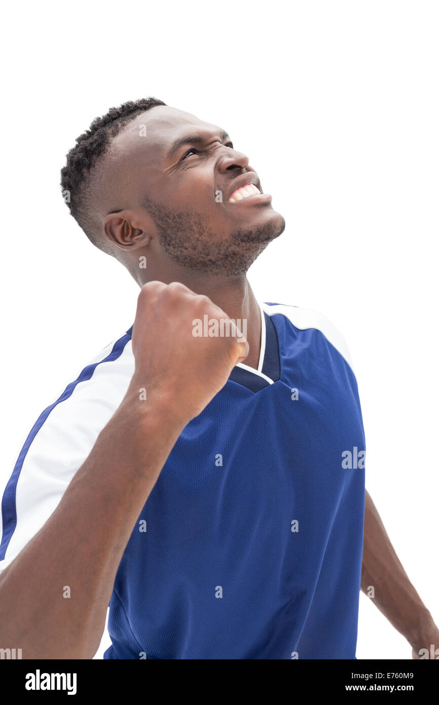 Sporty football player looking up Stock Photo - Alamy