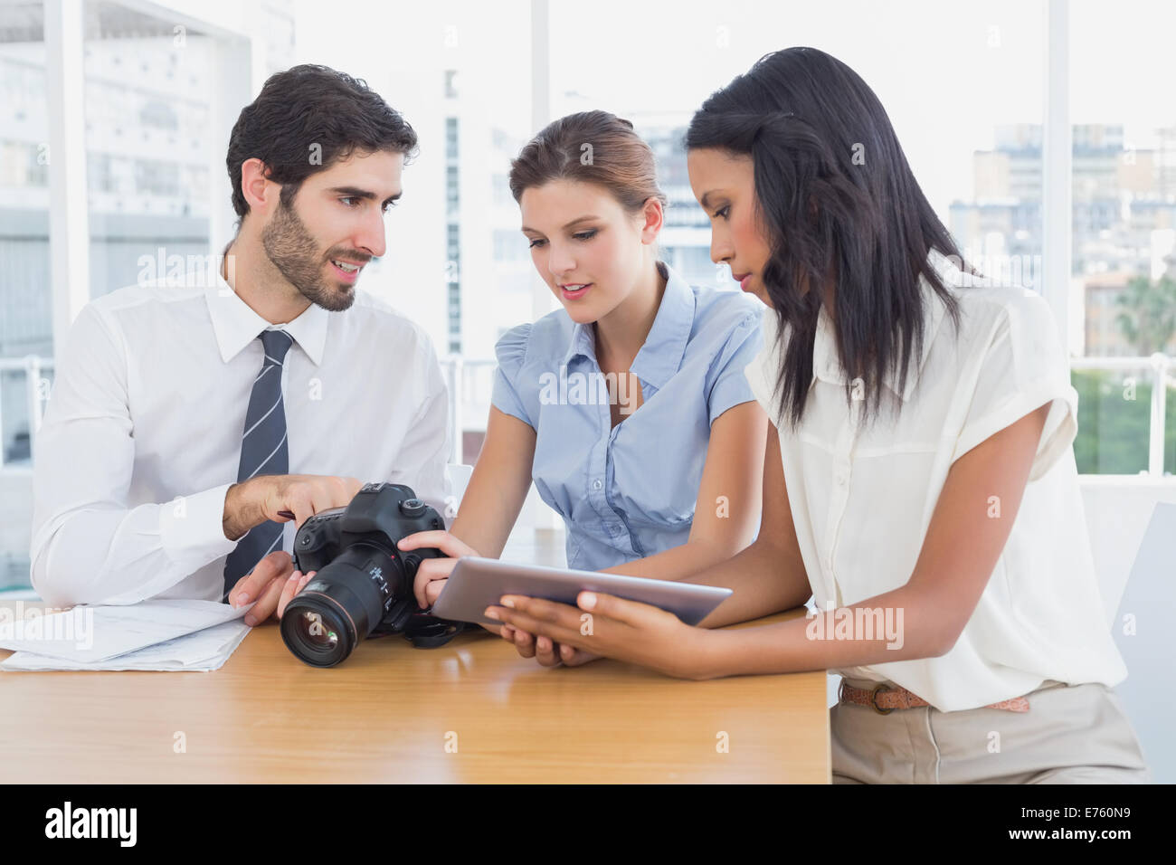 Business people using a camera Stock Photo - Alamy