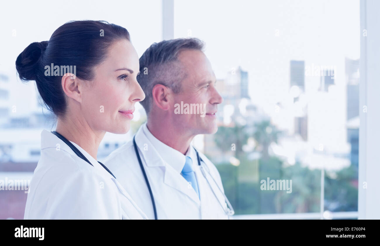 Doctors looking out the window Stock Photo - Alamy