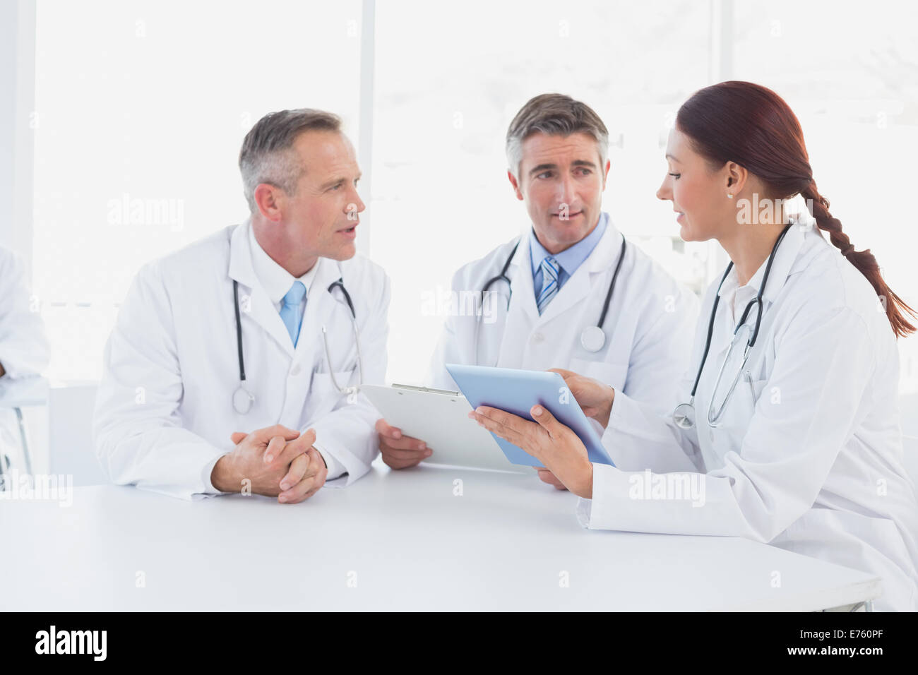 Doctors using a tablet together Stock Photo - Alamy