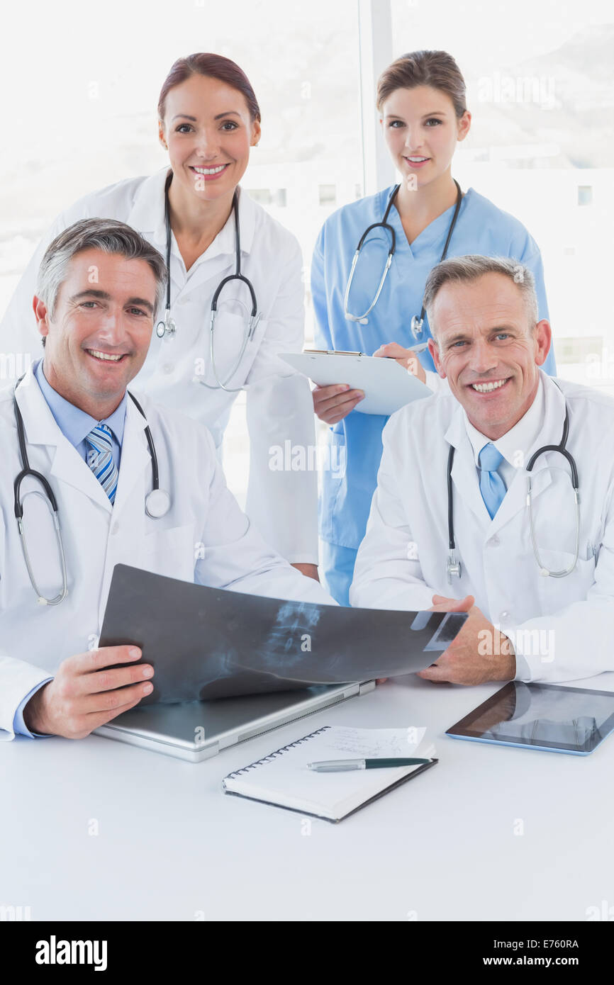 Doctor holding up an x-ray Stock Photo - Alamy