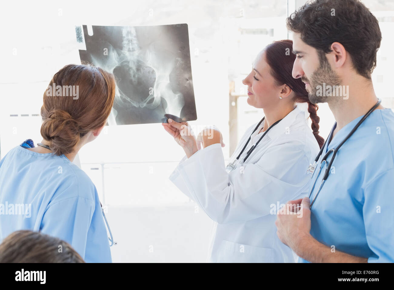 Doctor holding up an x-ray Stock Photo - Alamy