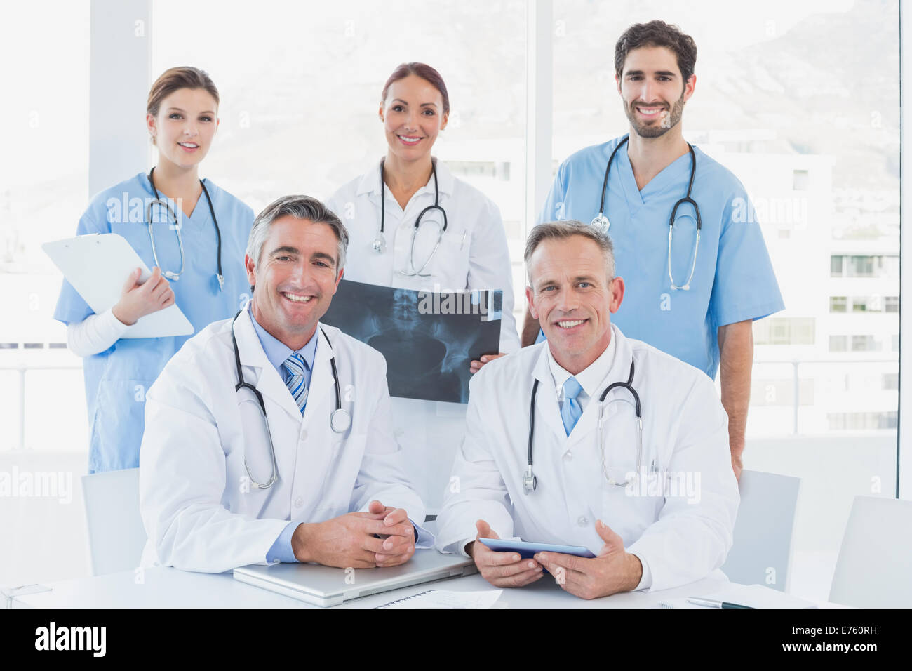 Doctors smiling at the camera Stock Photo - Alamy