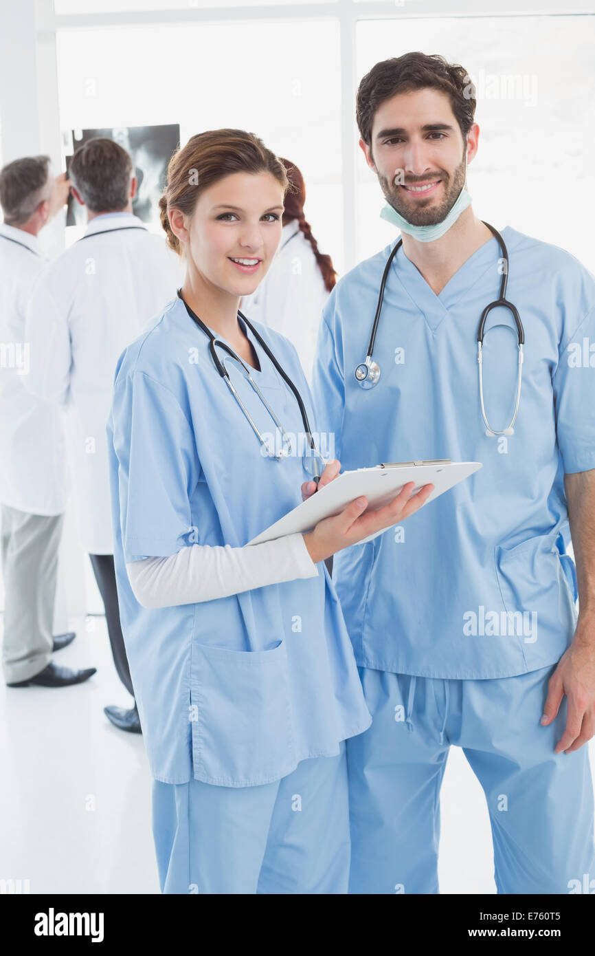Nurses holding a file together Stock Photo - Alamy