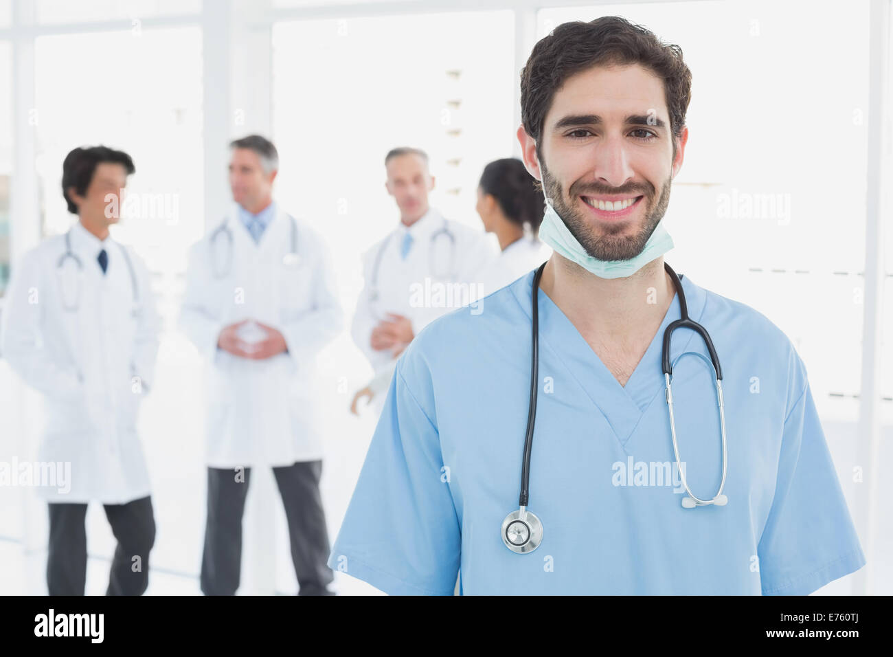 Smiling doctor looking at camera Stock Photo - Alamy
