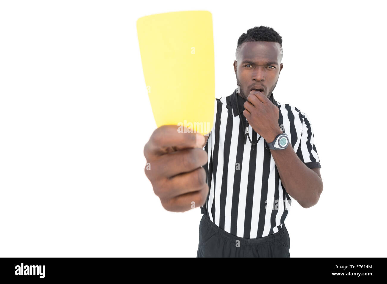 Serious referee showing yellow card Stock Photo - Alamy