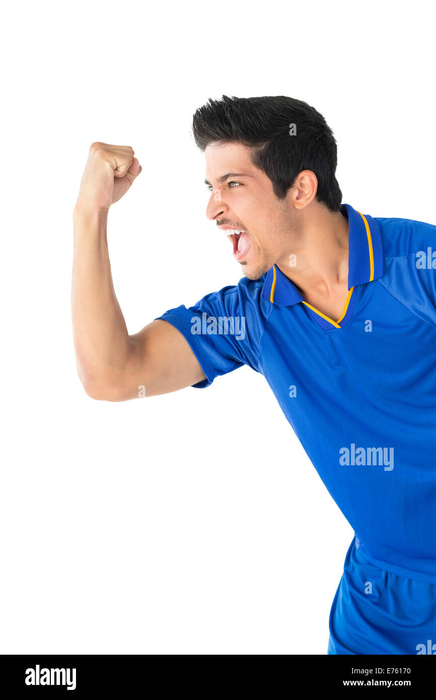Athletic football player cheering Stock Photo - Alamy