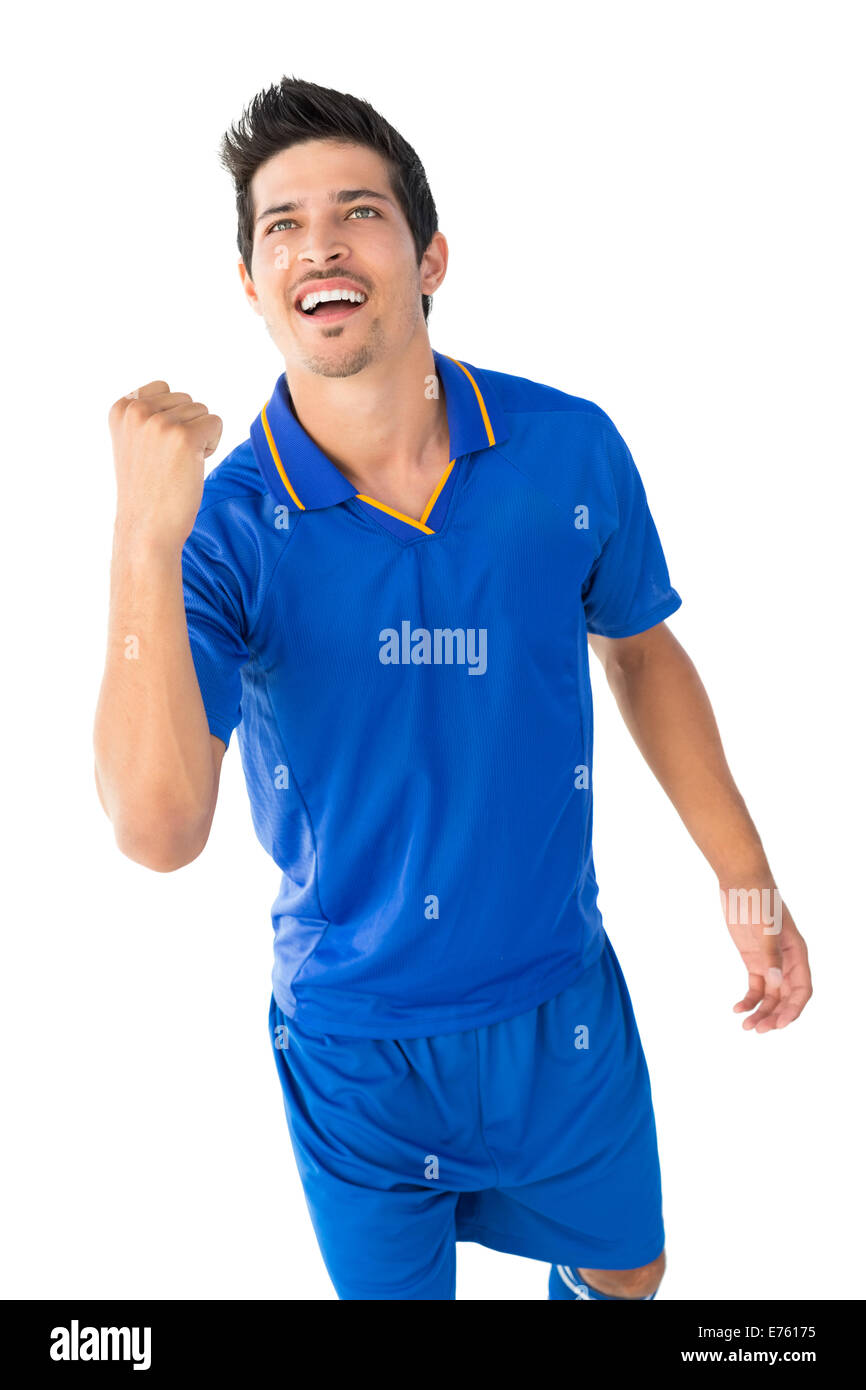 Athletic football player cheering Stock Photo - Alamy