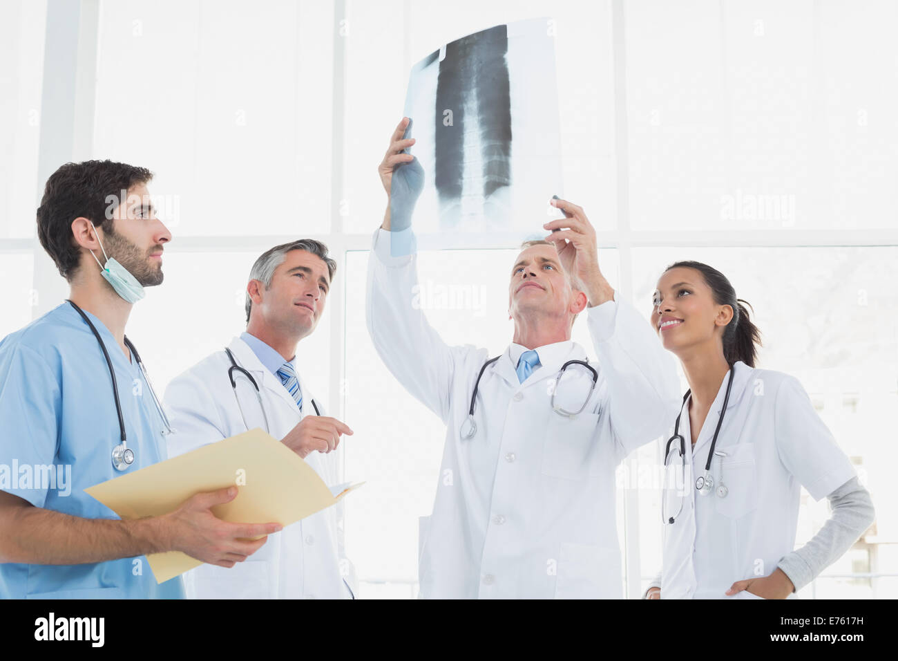 Doctor holding up an x-ray Stock Photo - Alamy
