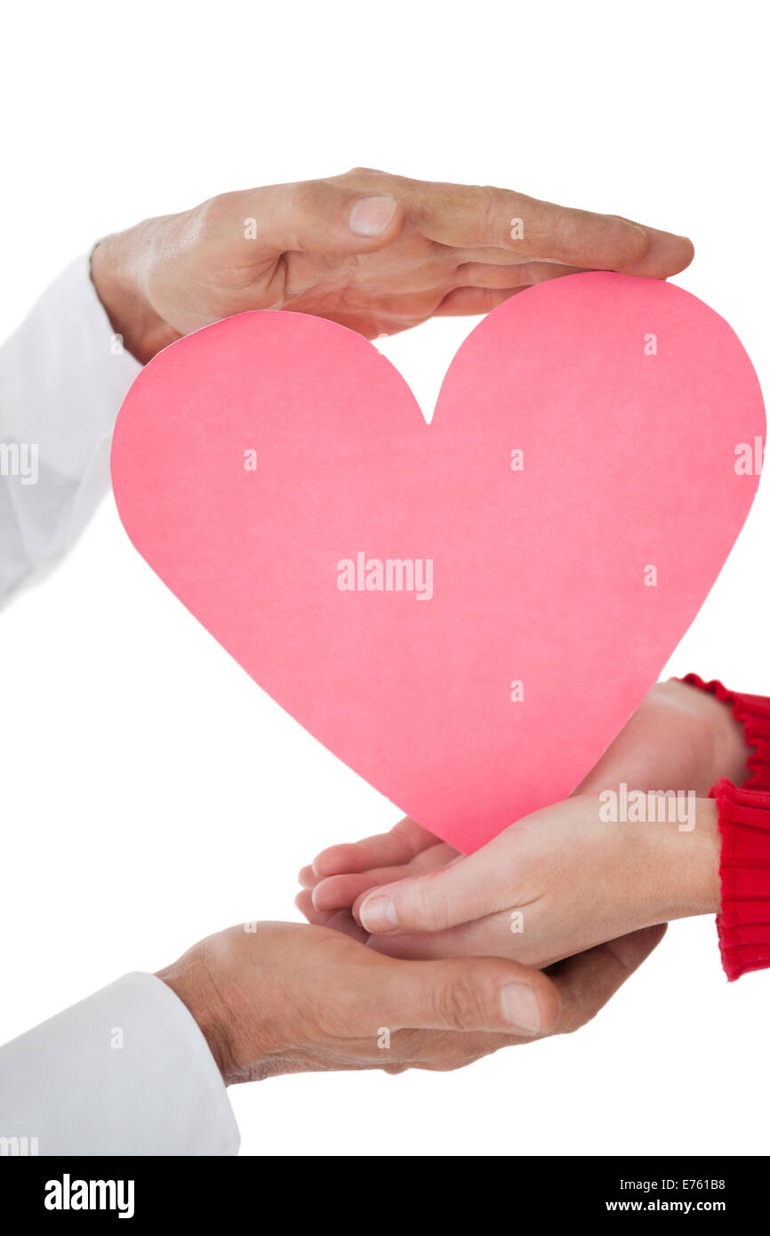 Close up of hands holding heart Stock Photo - Alamy