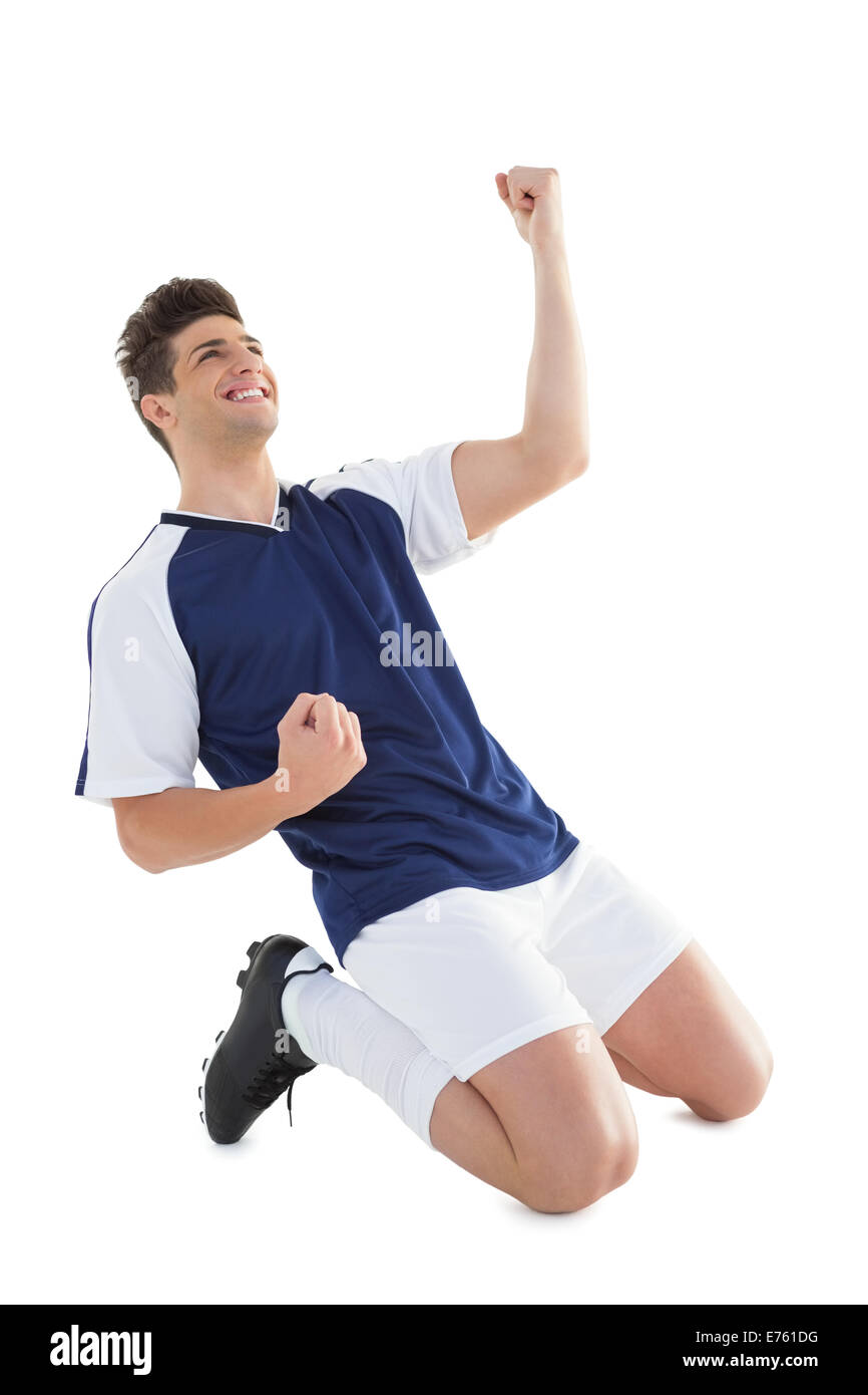 Athletic football player cheering Stock Photo - Alamy